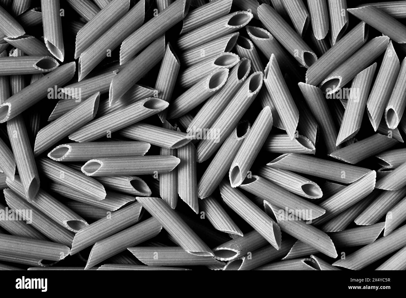 Macaroni close up, top view, in black and white. Abstract background ...