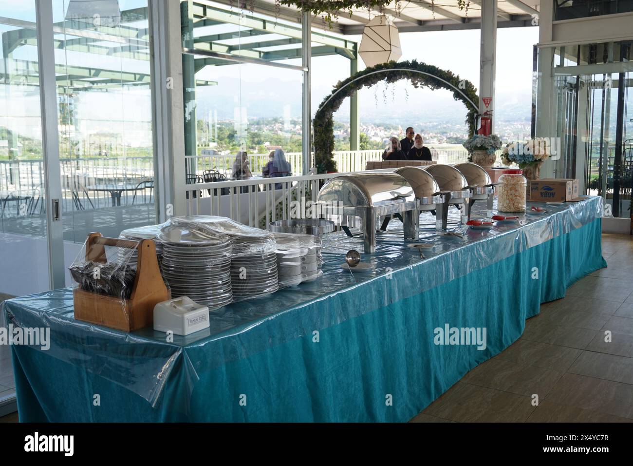 A buffet food place that is still closed at an event in Indonesia Stock ...