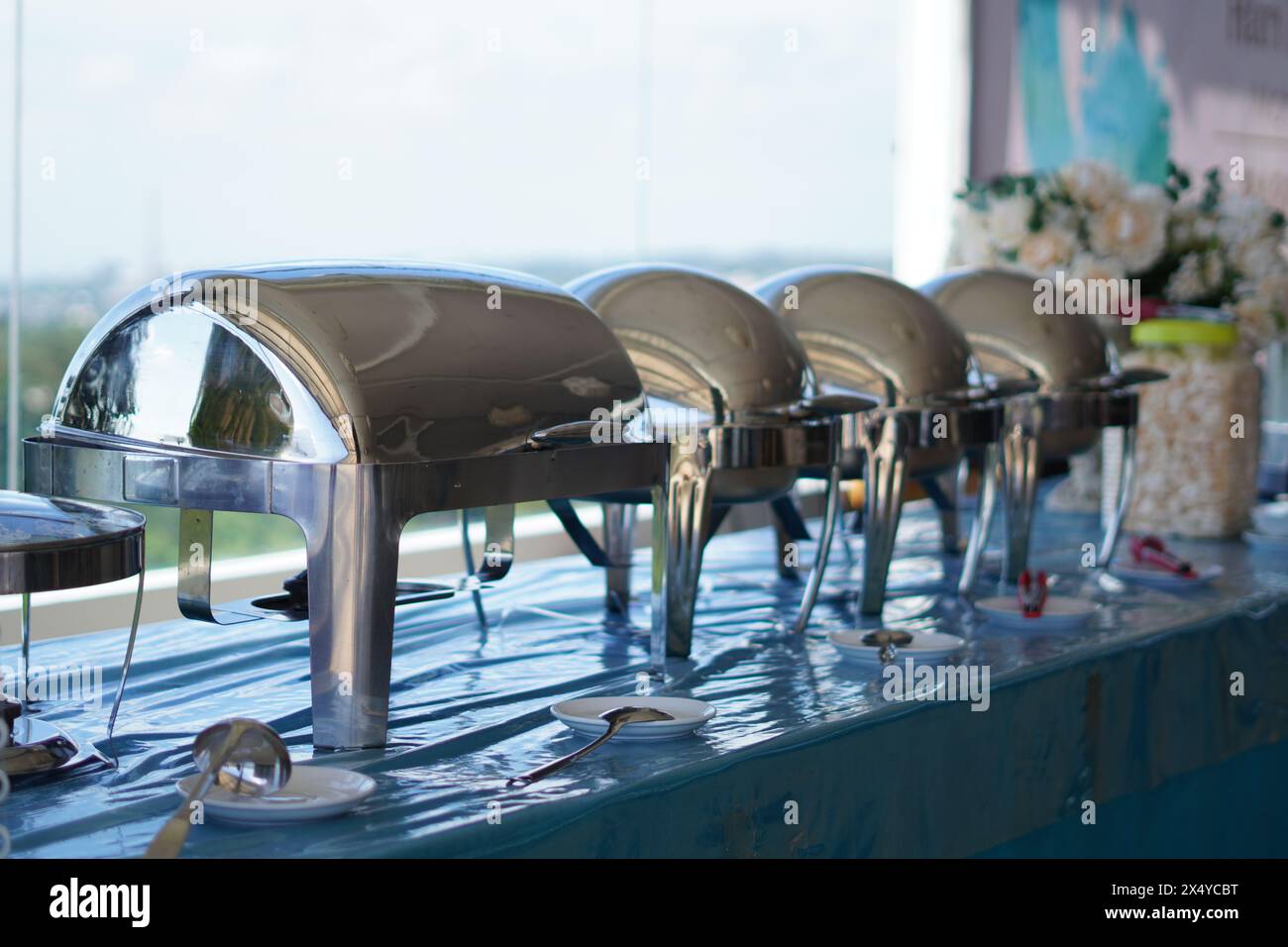 The silver-covered buffet dining area at an event in Indonesia Stock ...