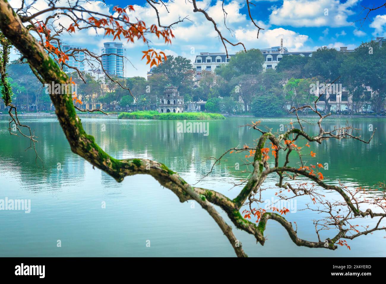 Branch of leaves with Turtle Tower on the foundation of Ho Guom Lake ...