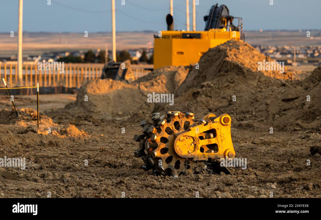 Close view of compaction wheel excavator attachment in the construction ...