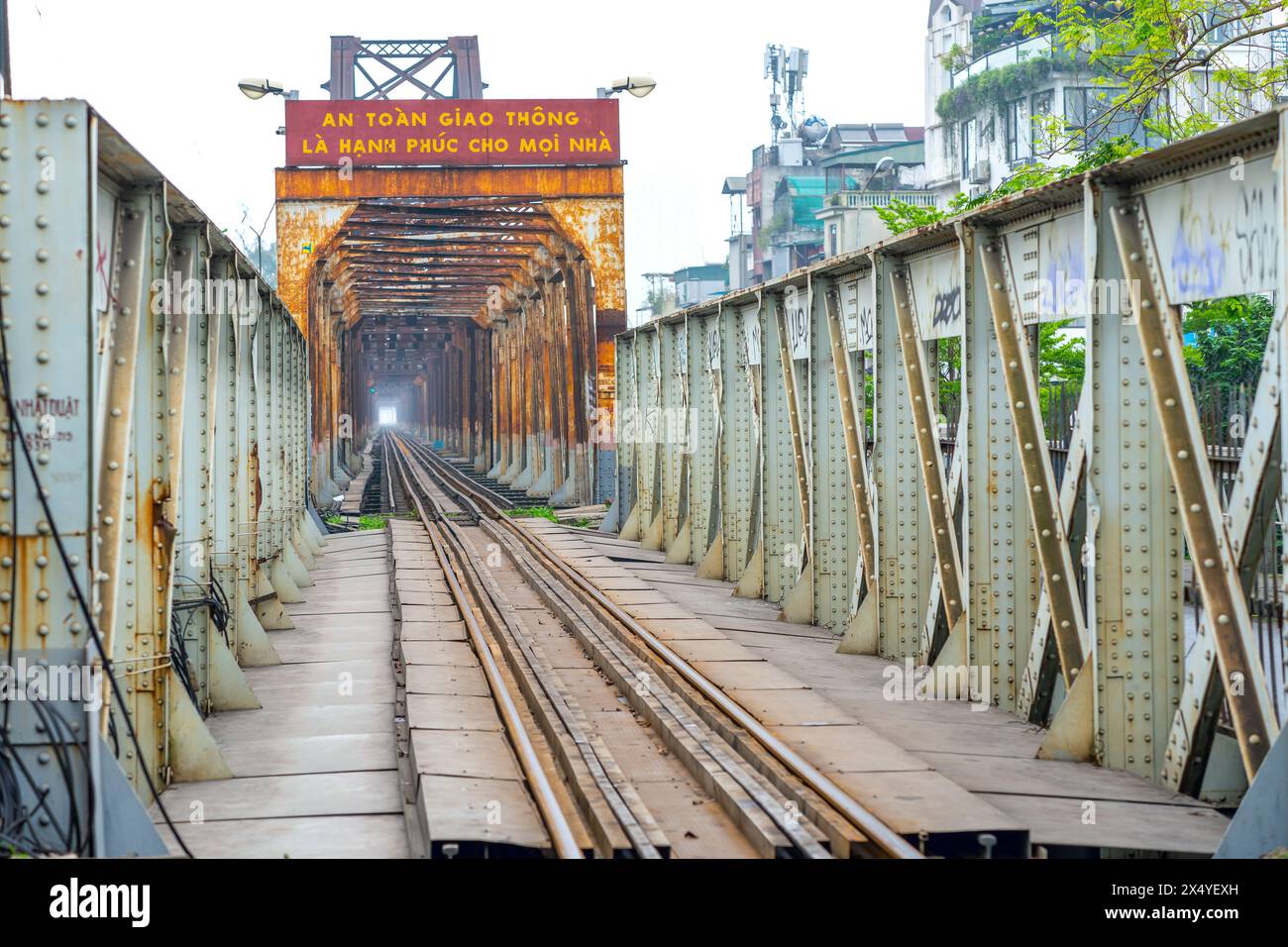 Vintage railroad tracks leading over the famous Long Bien Bridge. This ...