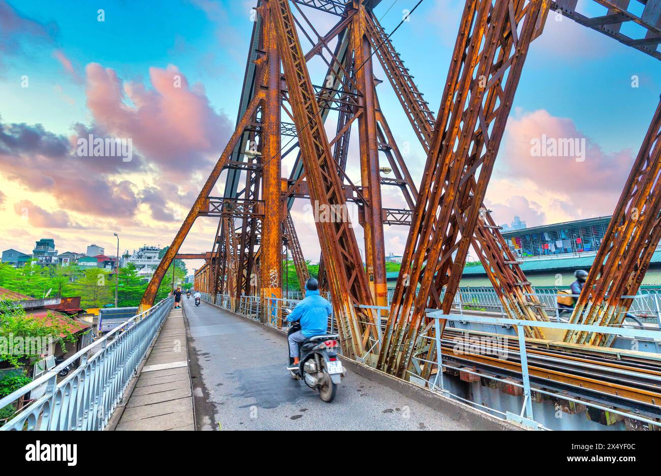 Vintage railroad tracks leading over the famous Long Bien Bridge. This ...