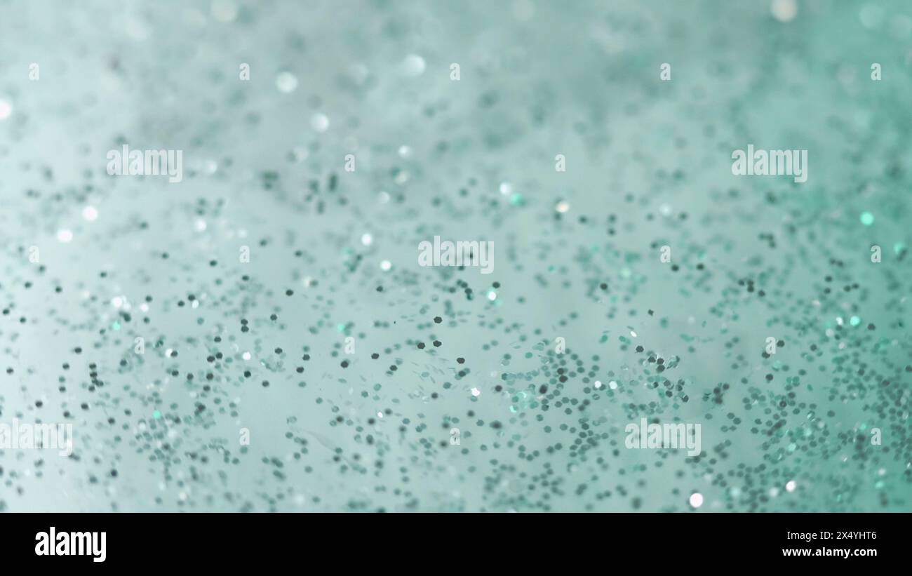 Glitter paint. Celebrate sequins. Defocused blue green blink particles ...
