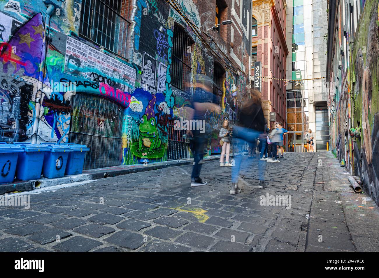 MELBOURNE, AUSTRALIA - APRIL 12, 2024: Tourists roaming in Hosier Lane ...