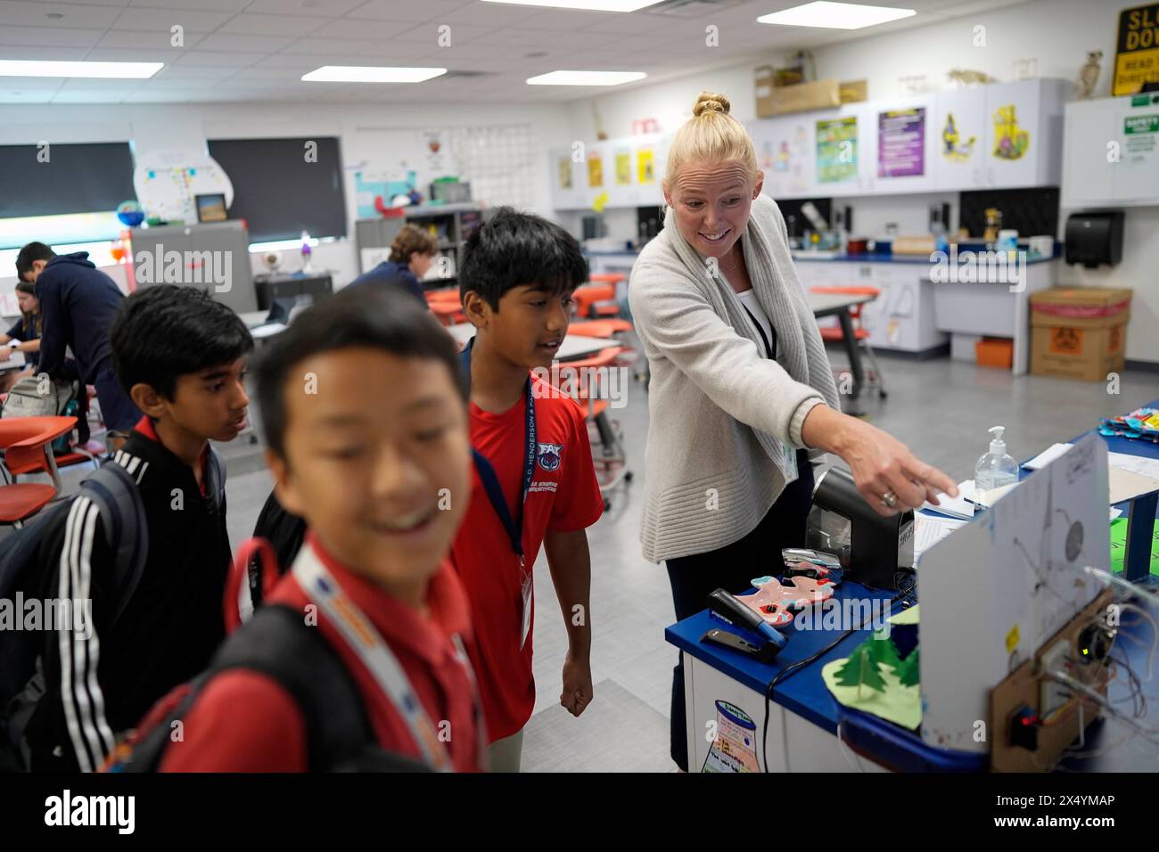 Middle school science teacher Vanessa Stevenson, right, talks with ...
