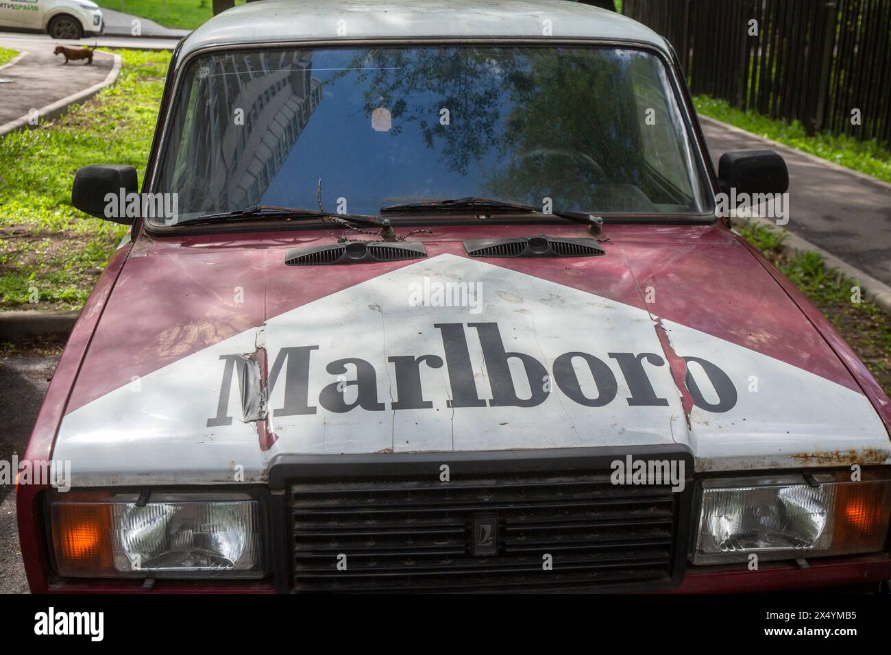 A Soviet AVTOVAZ car is parked in a residential area of Moscow, Russia ...
