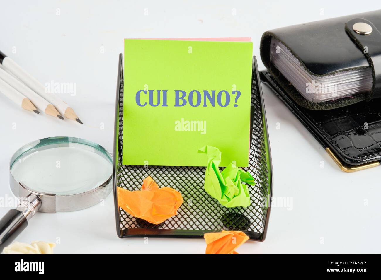 CUI BONO (to whose benefit) question on a green sticker next to the ...