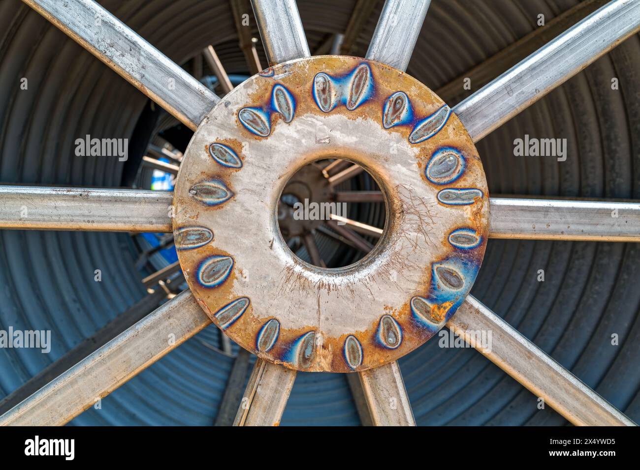 The detail of the hub and center spokes of a spool of fiber optic cable ...