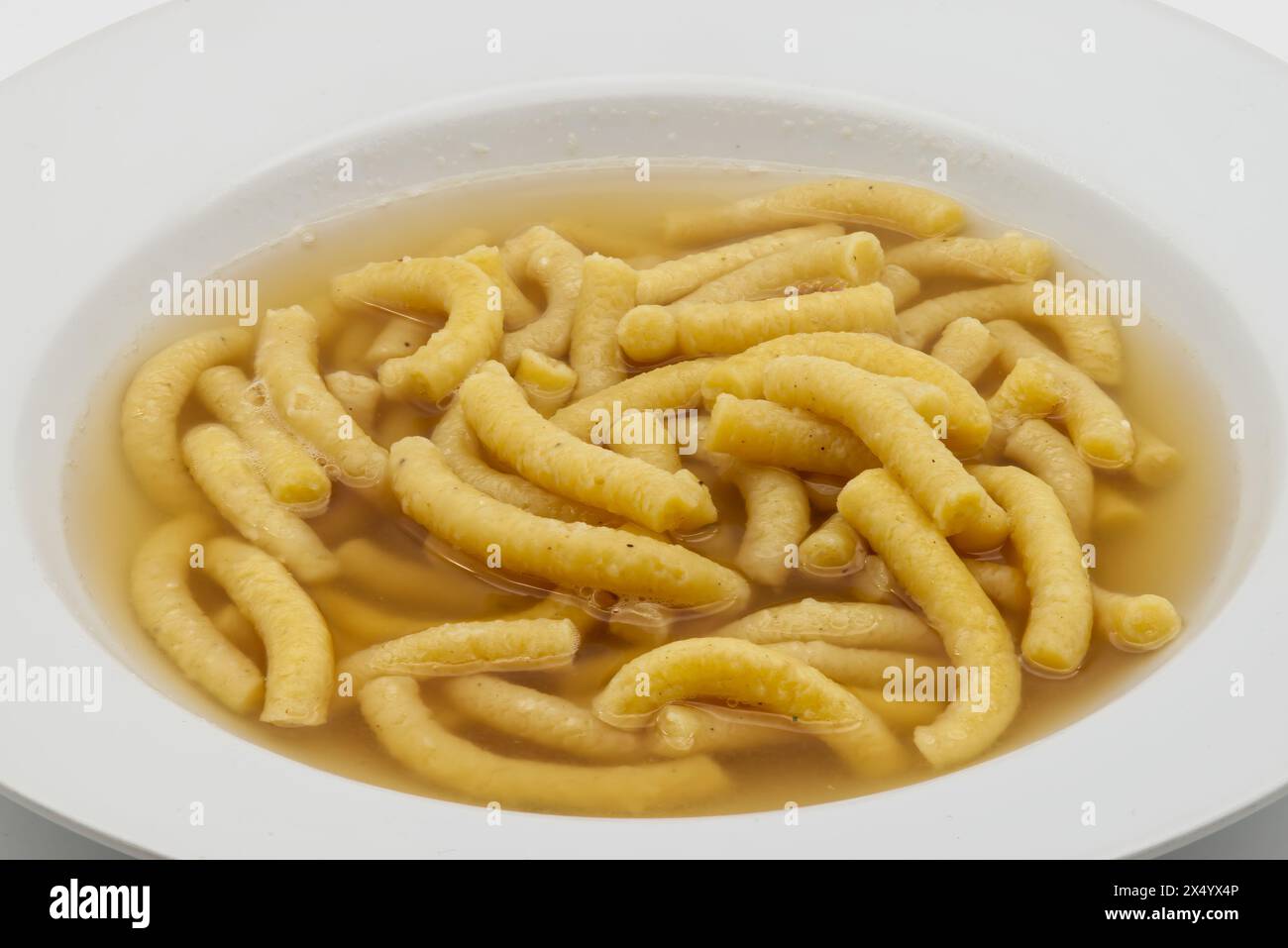 Italian Passatelli. Traditional Italian pasta cooked in broth. Bologna ...