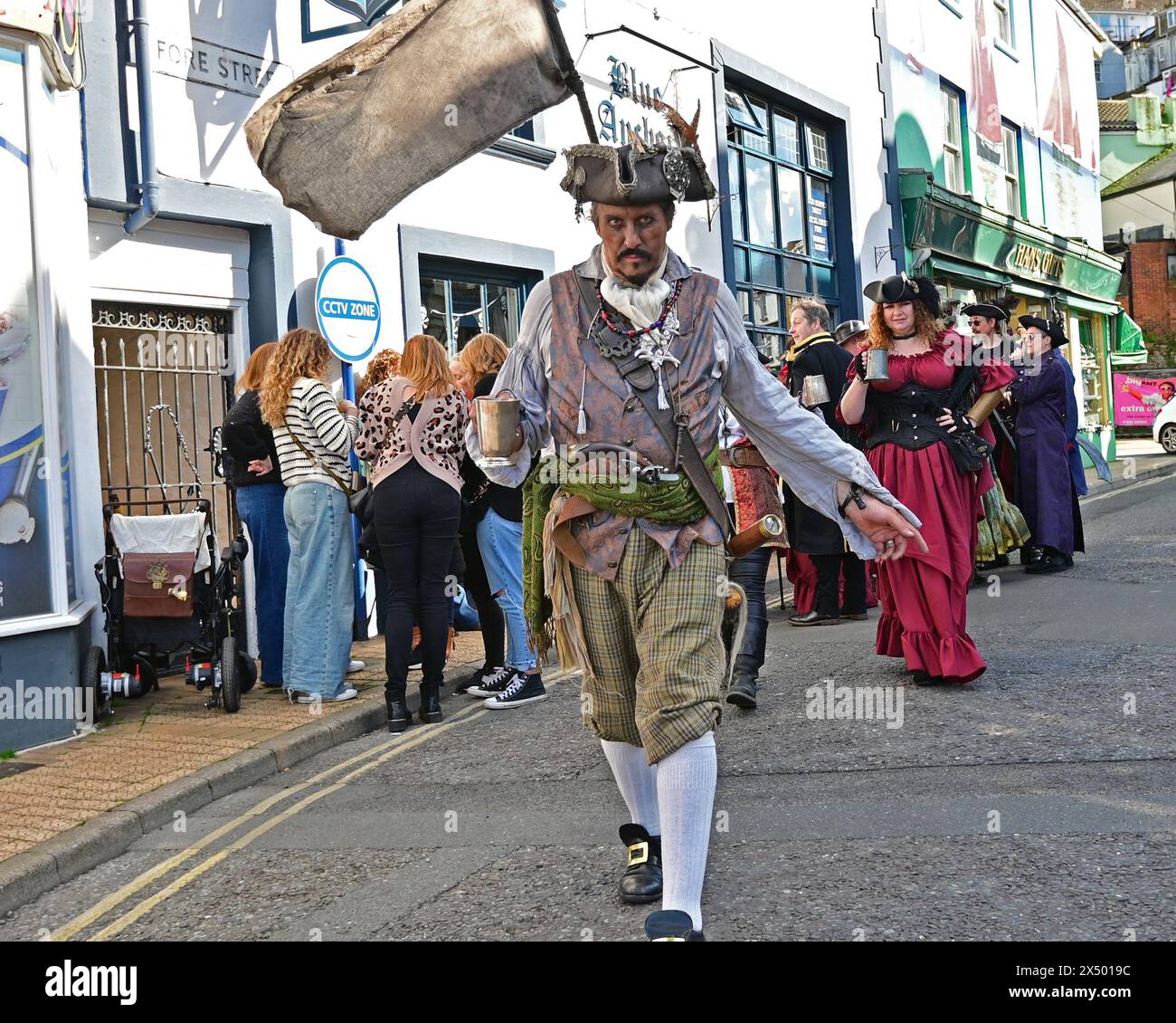 Boats and people in Pirate dress are seen flying the flag and getting ...