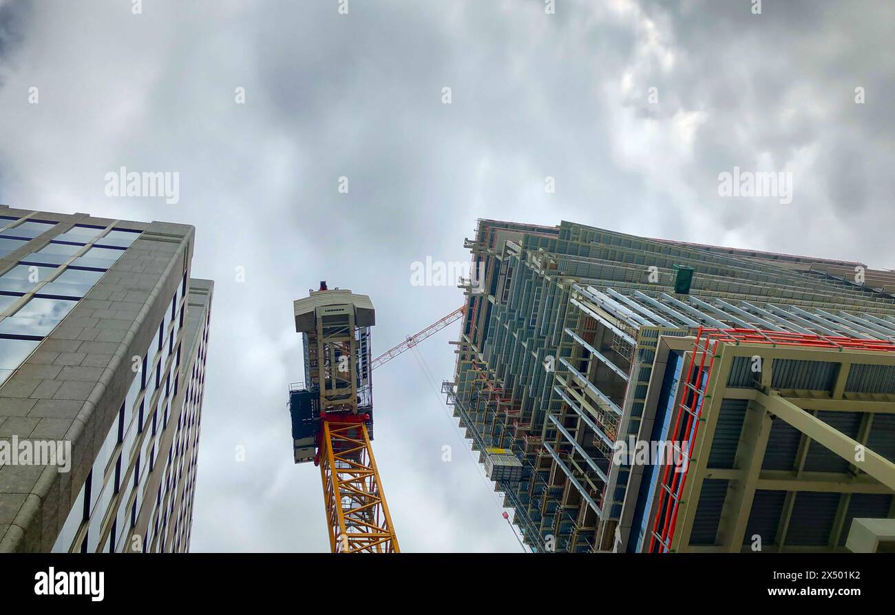 The image captures the upward expansion of an urban landscape ...