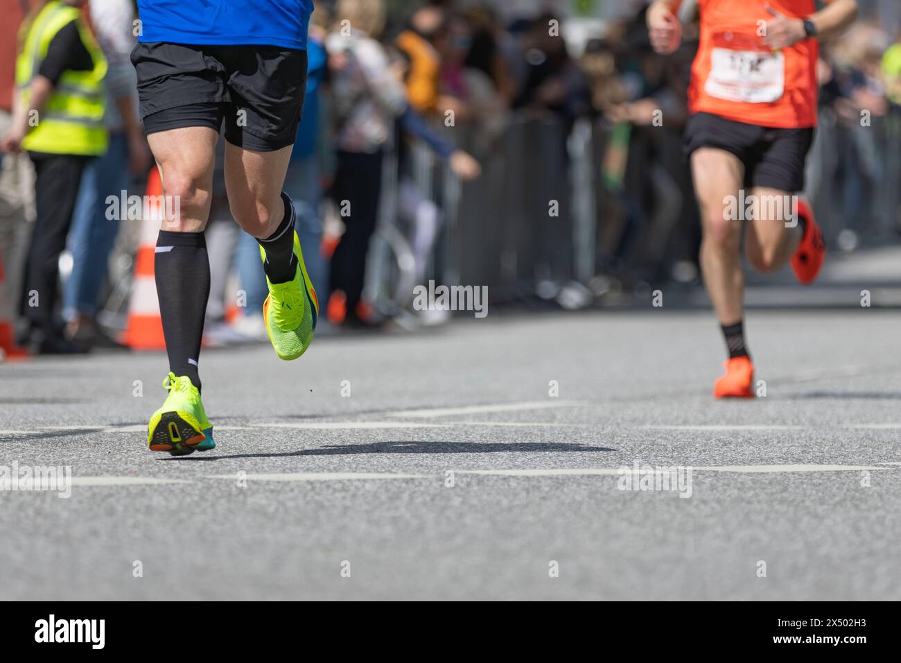 Legs of marathon runners on the street Stock Photo - Alamy