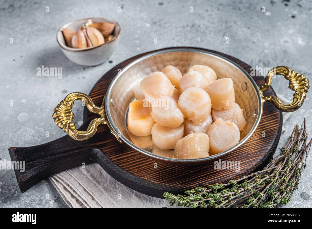 Raw sea scallops fillets in a skillet. Gray background. Top view Stock ...