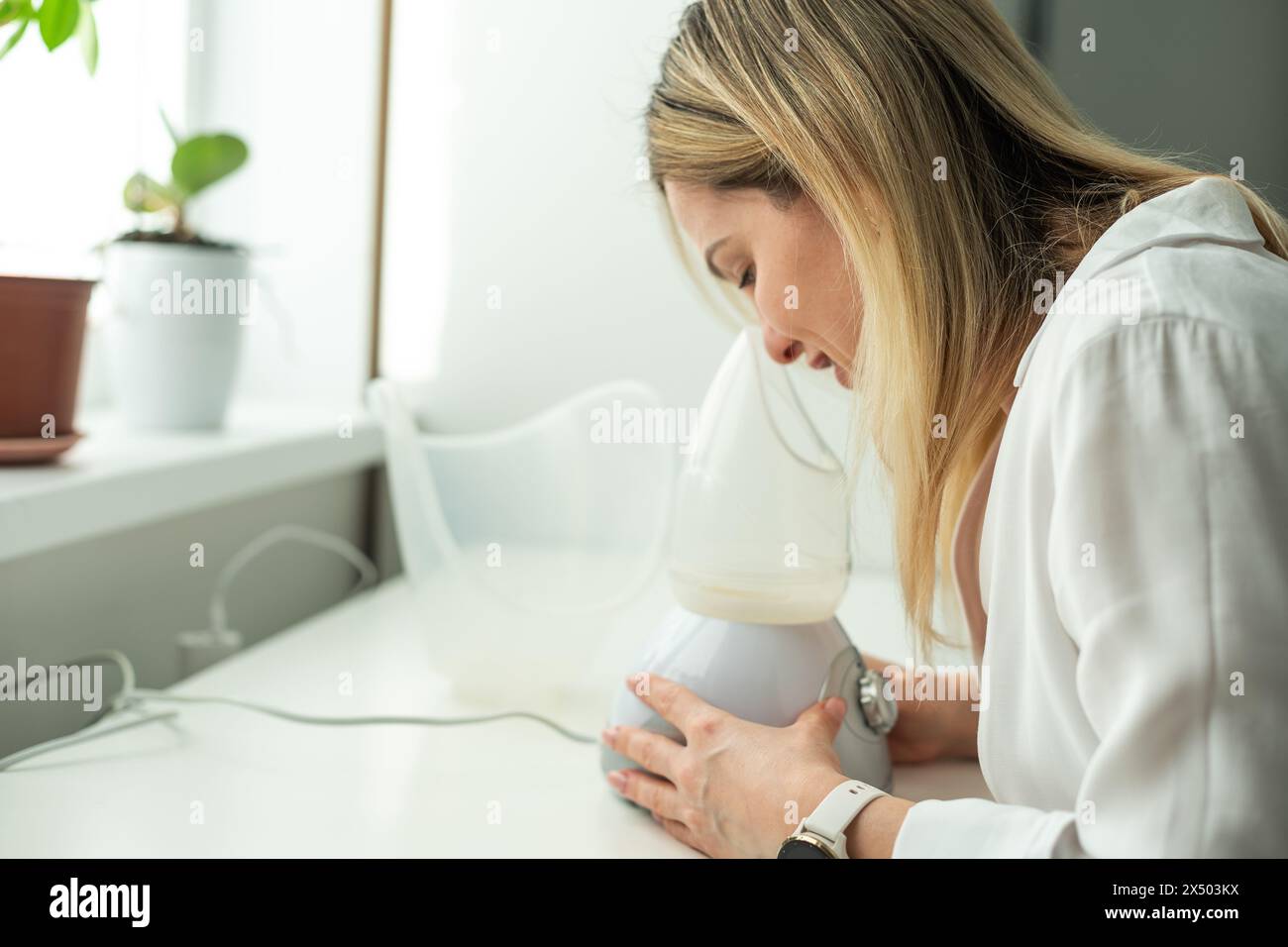 Woman has a bad cold and is trying therapy by inhaler Stock Photo - Alamy