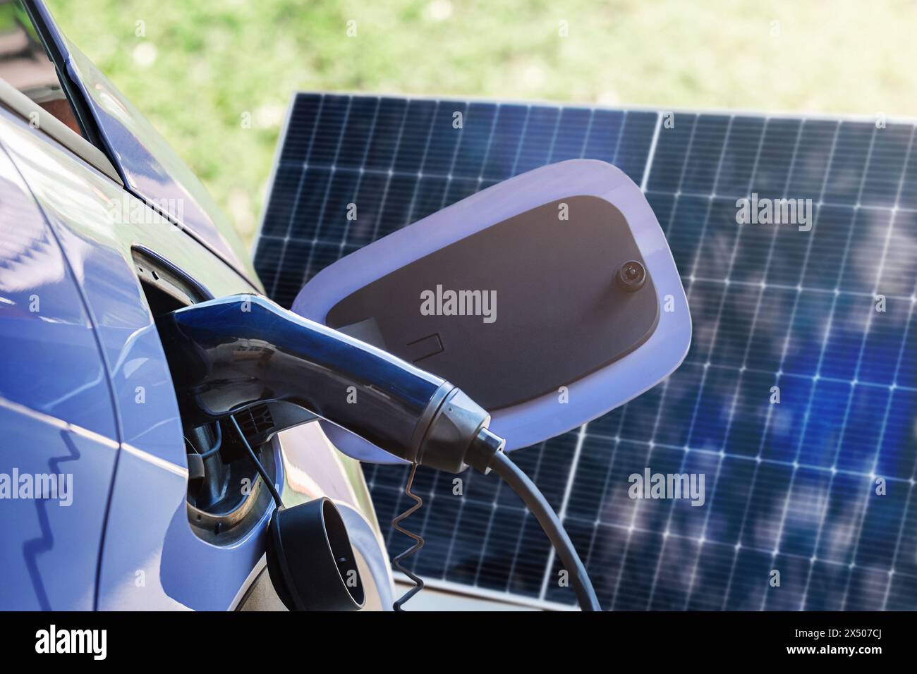 electric car EV charging from a solar panel close-up outdoors Stock ...