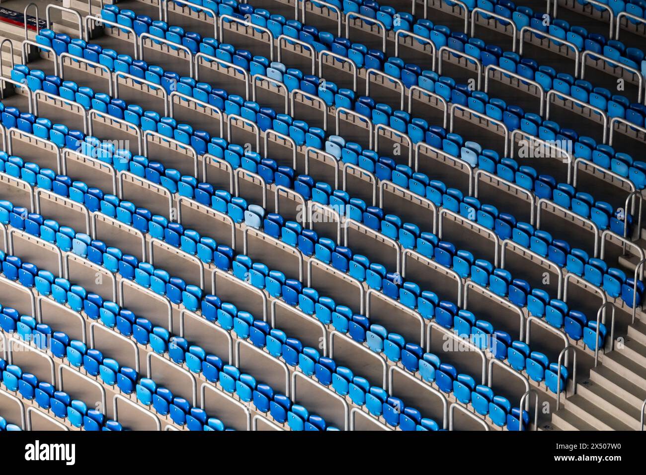 Blue and white stadium seats arrayed in a diagonal pattern, showcasing ...