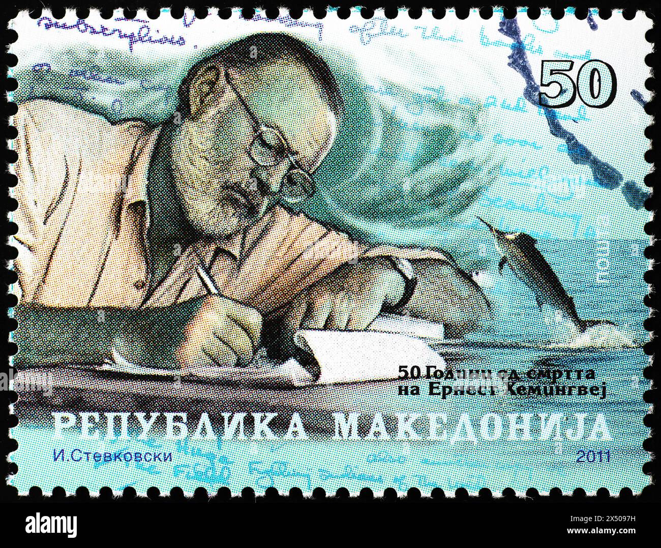 Ernest Hemingway writing at his desk on postage stamp Stock Photo - Alamy