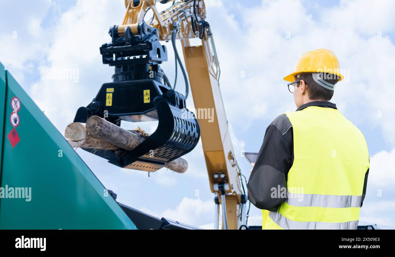 Worker with digital tablet controls process of loading timber Stock ...
