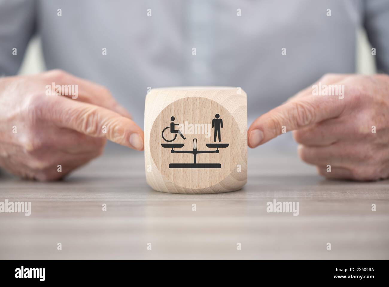 Wooden block with symbol of social equality concept Stock Photo - Alamy
