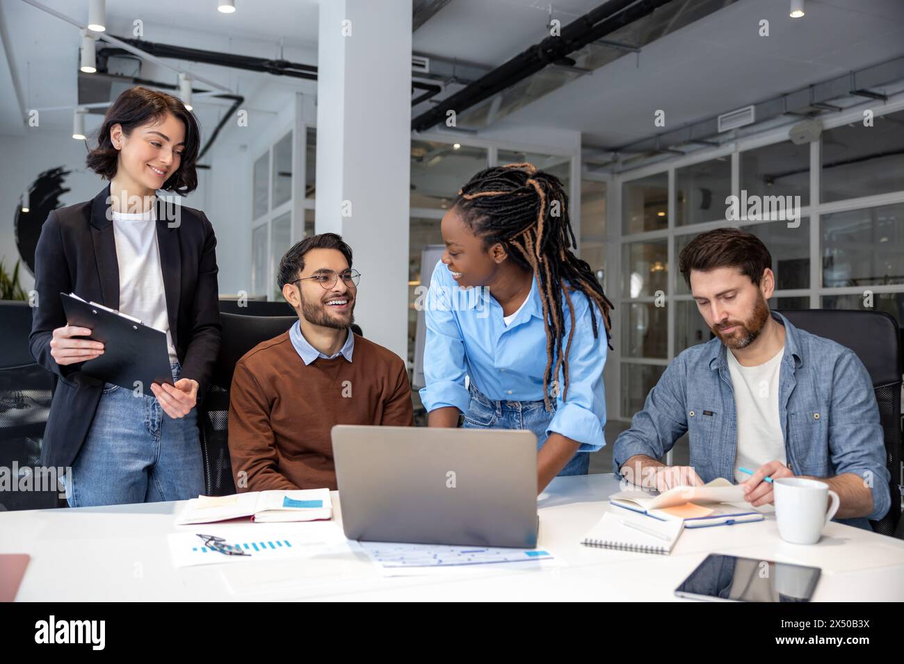 Young multicultural people collaborating hi-res stock photography and ...