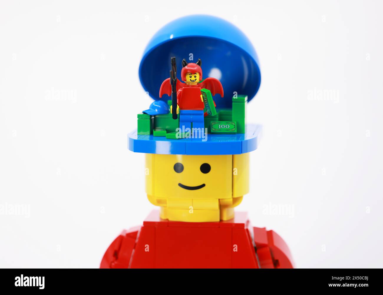 Hong Kong -May 6 2024: giant man head is full of money, the temptation ...