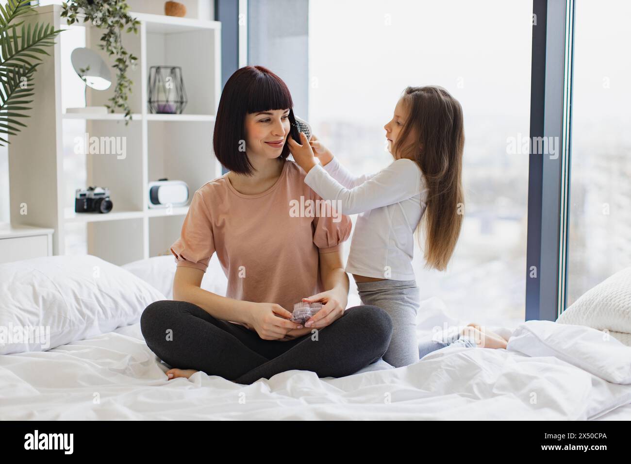 Happy Caucasian family having fun on bad on weekend morning Stock Photo ...