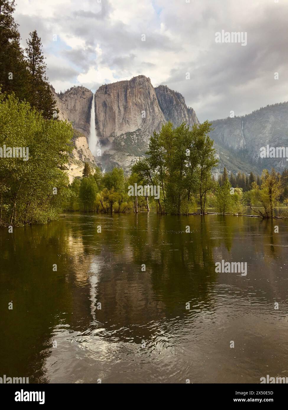 Waterfall flowing down steep cliff, Yosemite National Park, California ...