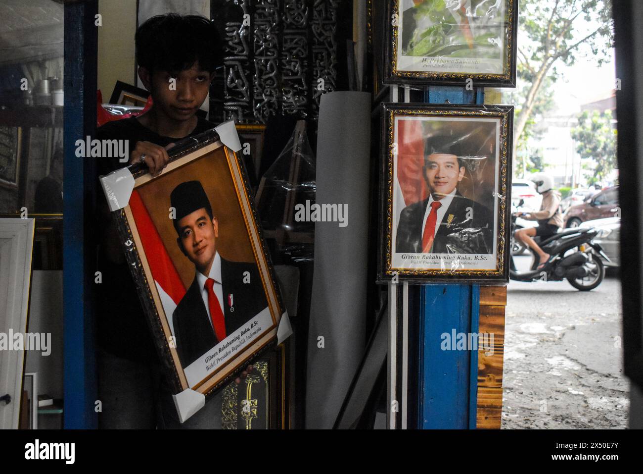 Bandung, West Java, Indonesia. 6th May, 2024. A vendor sells framed ...