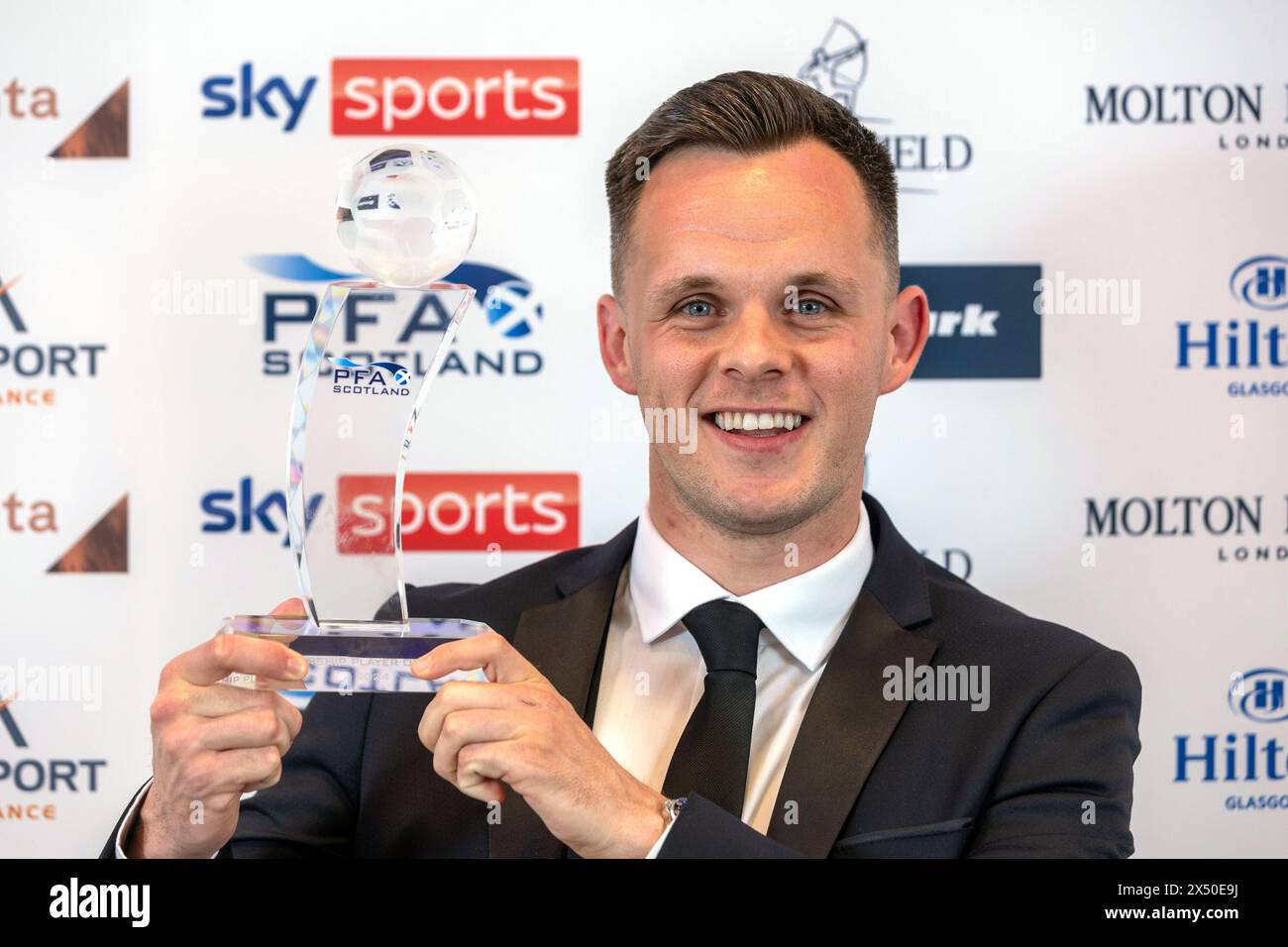 Heart of Midlothian's Lawrence Shankland with the award for Player of ...
