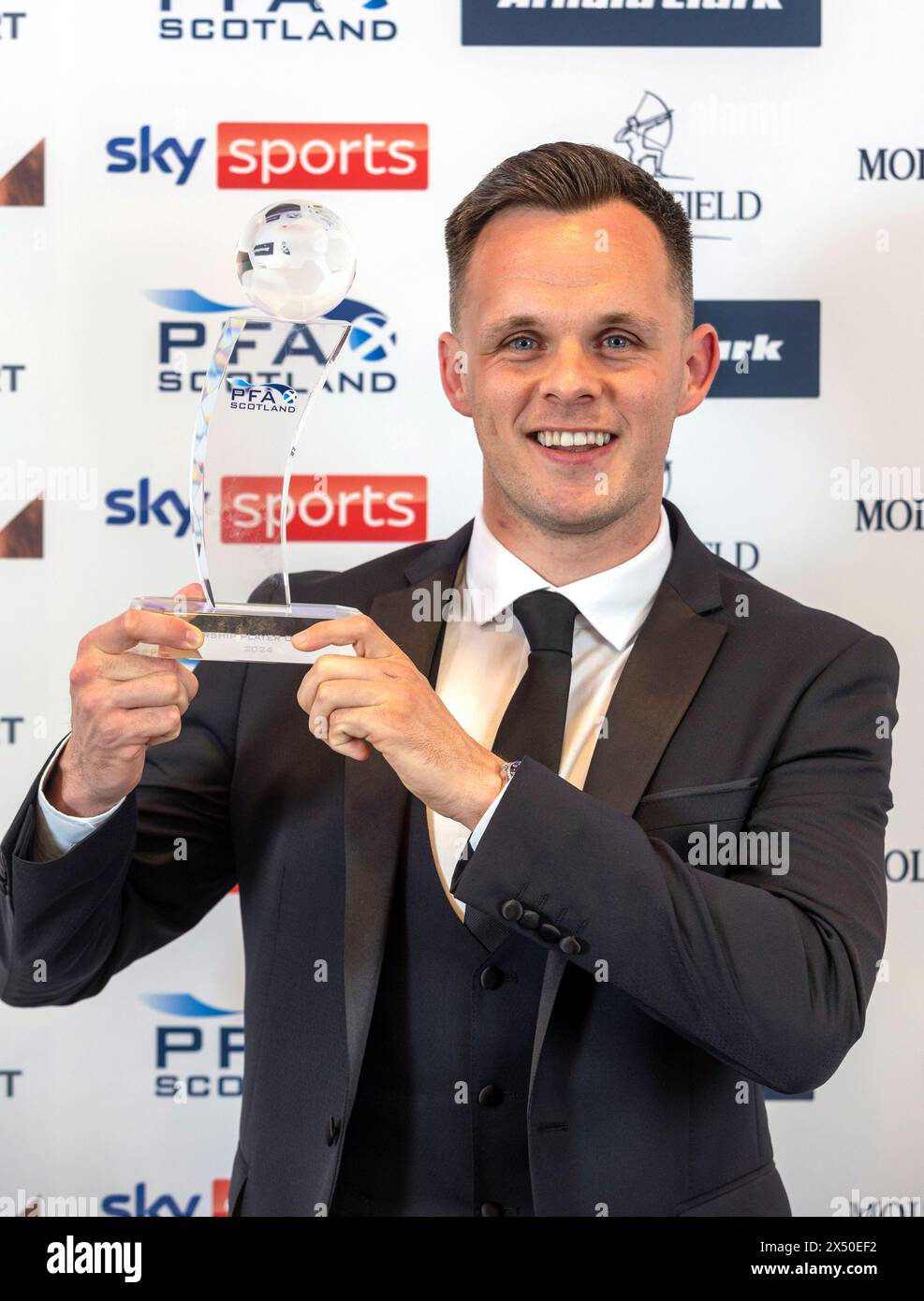 Heart of Midlothian's Lawrence Shankland with the award for Player of ...