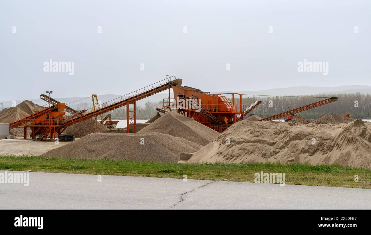 Concrete production plant. Piles of crushed stone and sand Stock Photo ...