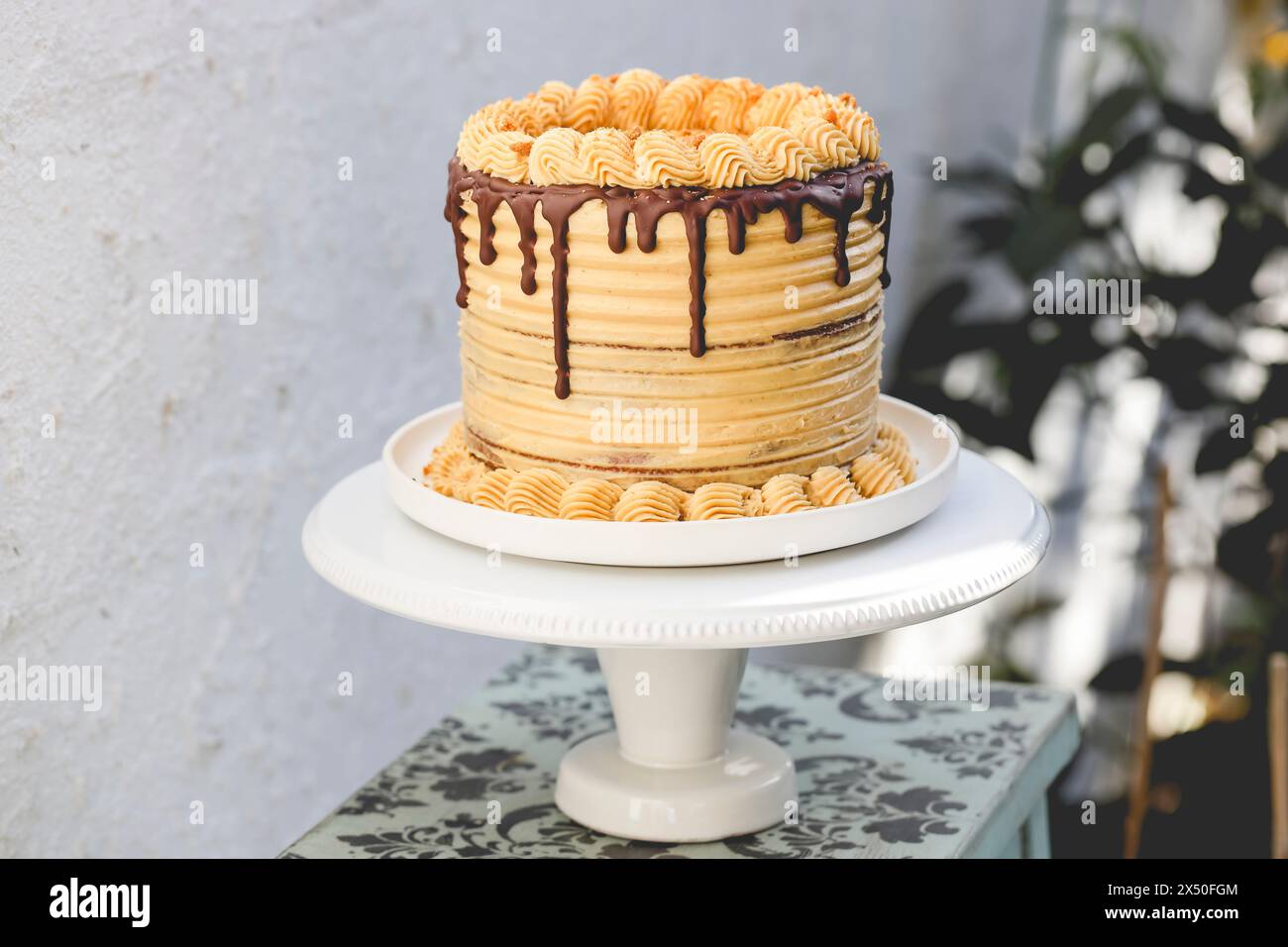 Close-up of a chocolate and cookie sponge layer cake with buttercream ...