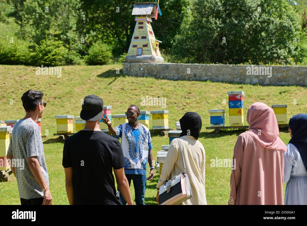 A diverse group of young friends and entrepreneurs explore small honey ...
