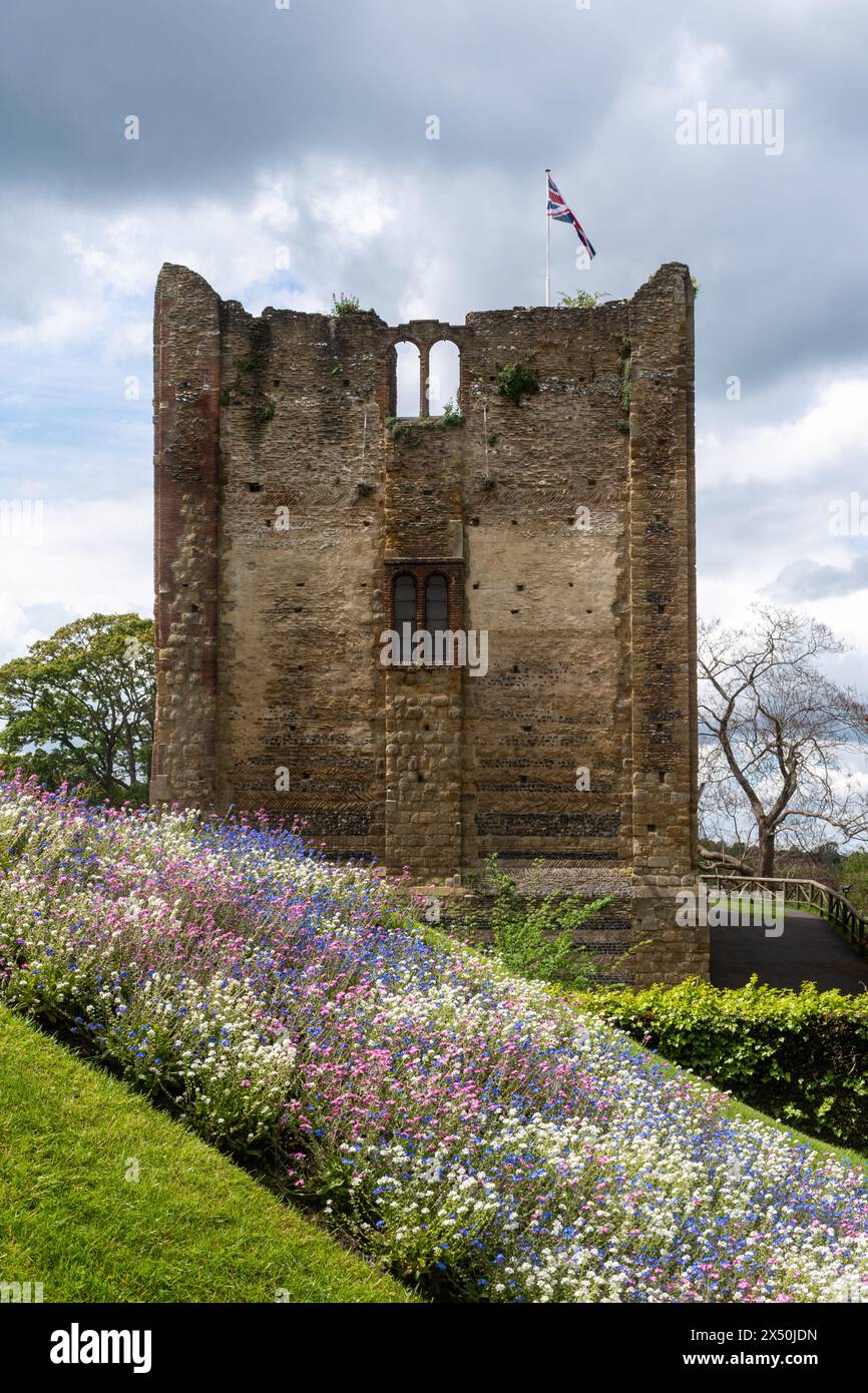 Guildford Castle Keep with colourful flowers in the gardens or grounds ...