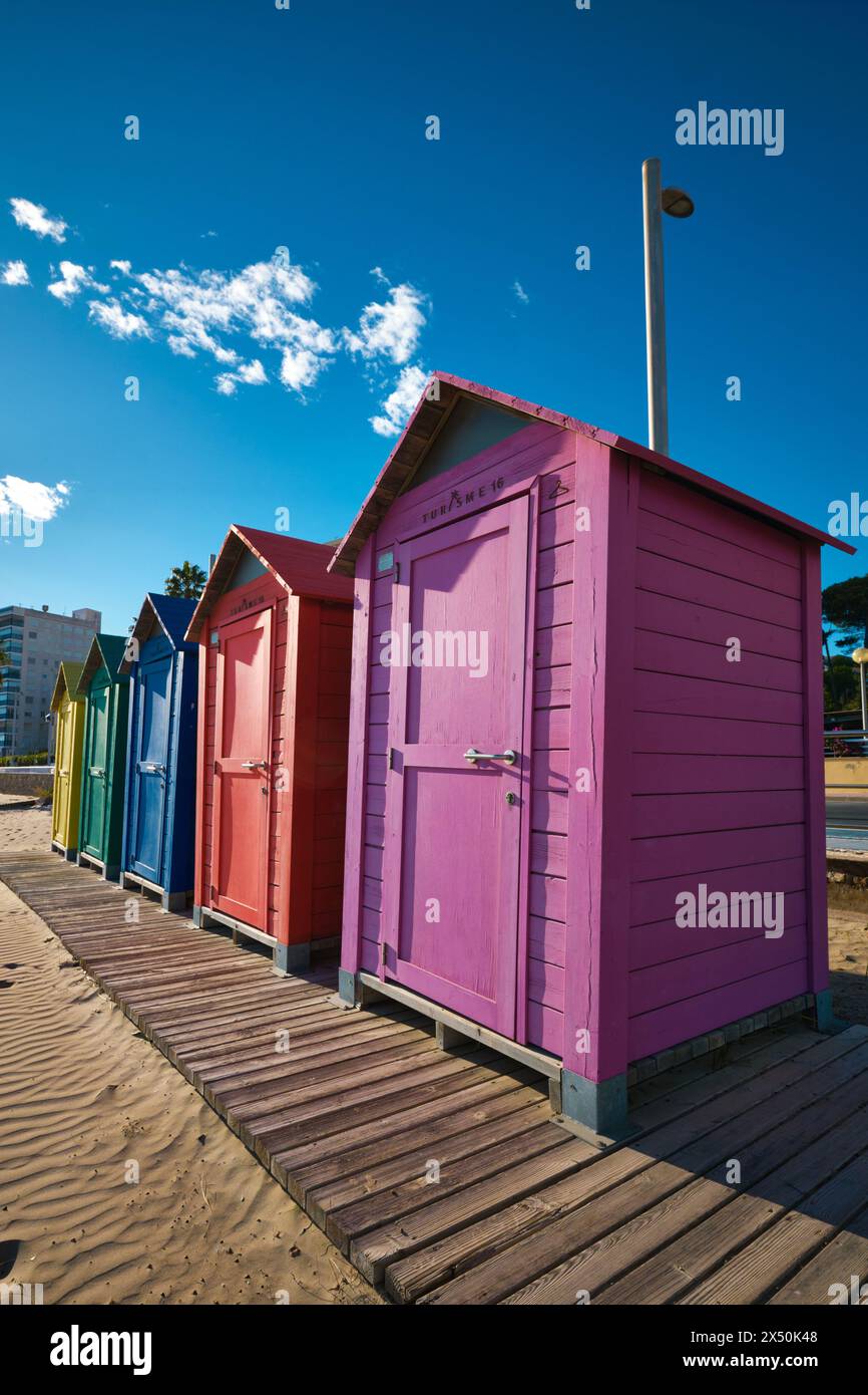 Brightly painted summer beach change rooms Stock Photo - Alamy
