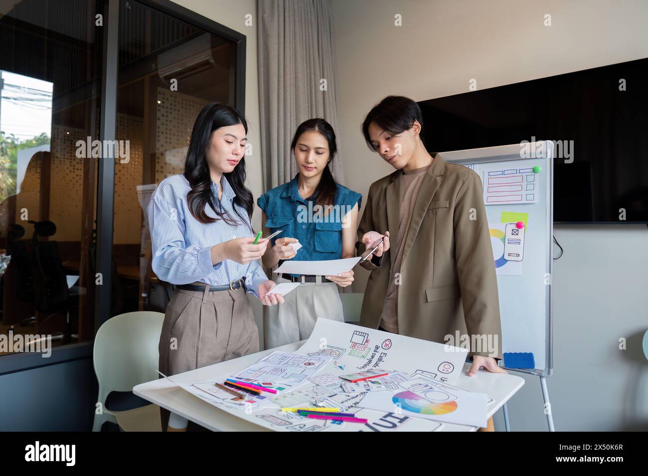 ux developer and ui designer presenting mobile app interface design on ...