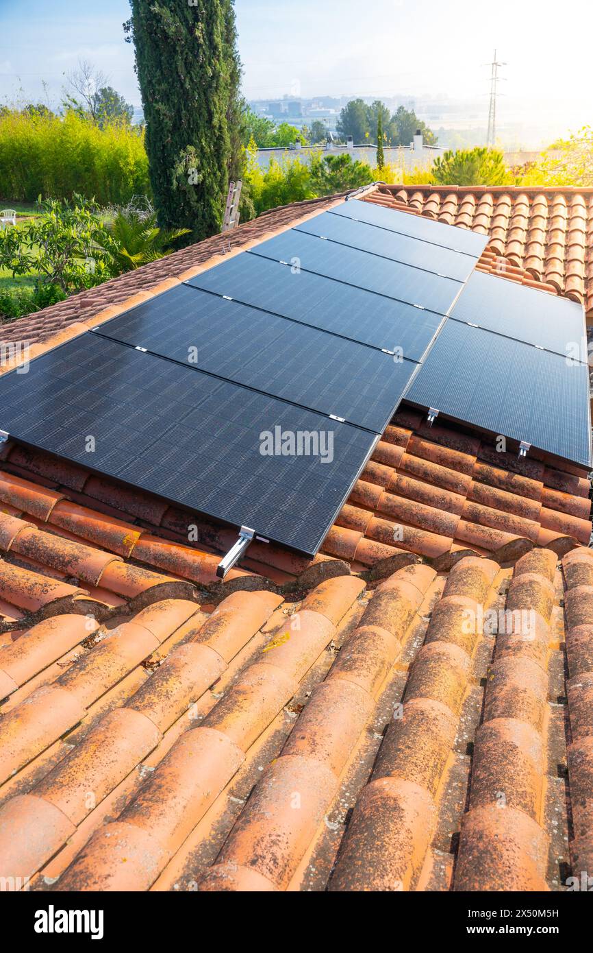 Solar panels line the rooftop, harnessing energy from the sun Stock ...