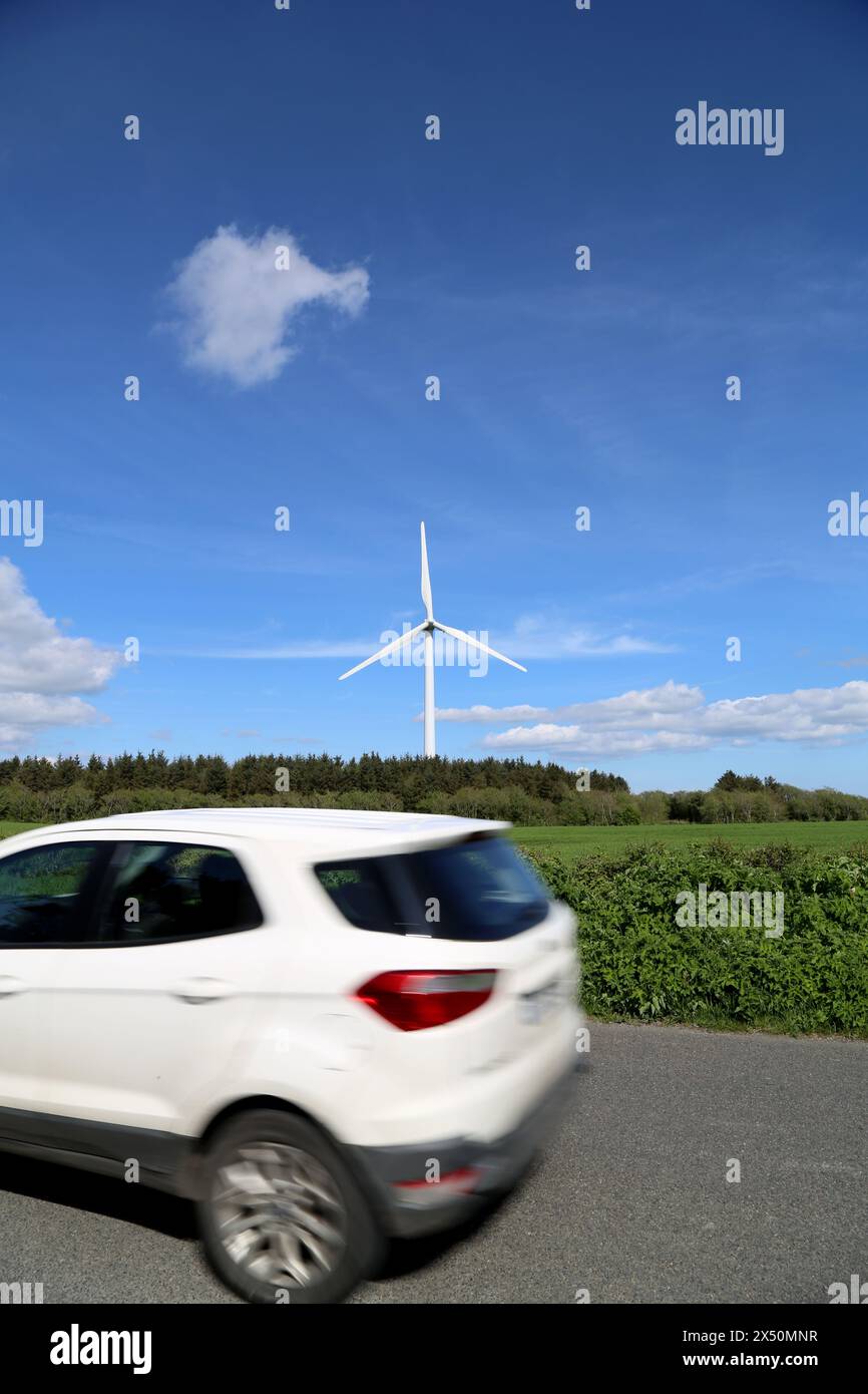 Blue car passing field hi-res stock photography and images - Alamy