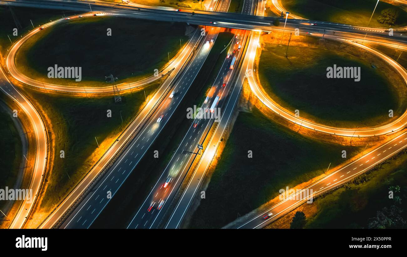 Road and Roundabout, multilevel junction motorway at night Stock Photo ...