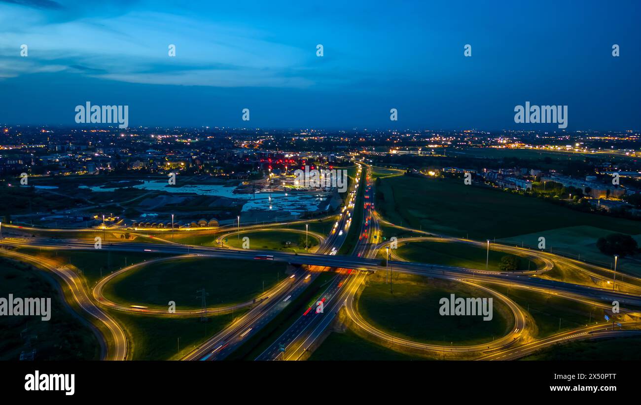 Road and Roundabout, multilevel junction motorway at night. Expressway ...