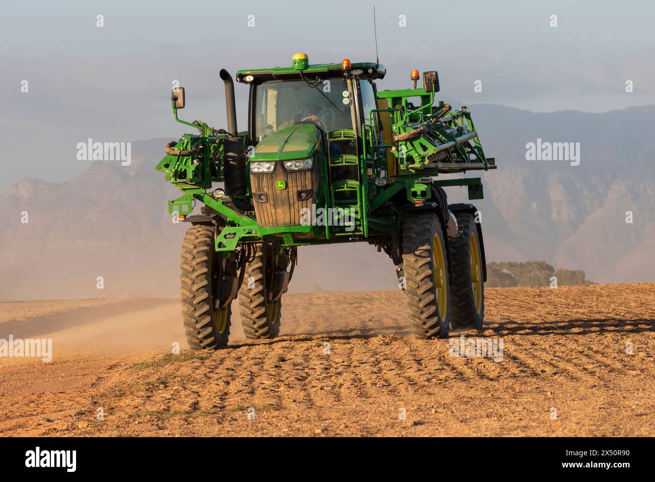 Western Cape, South Africa. 24 th April 2024. Tractor with spray boom ...