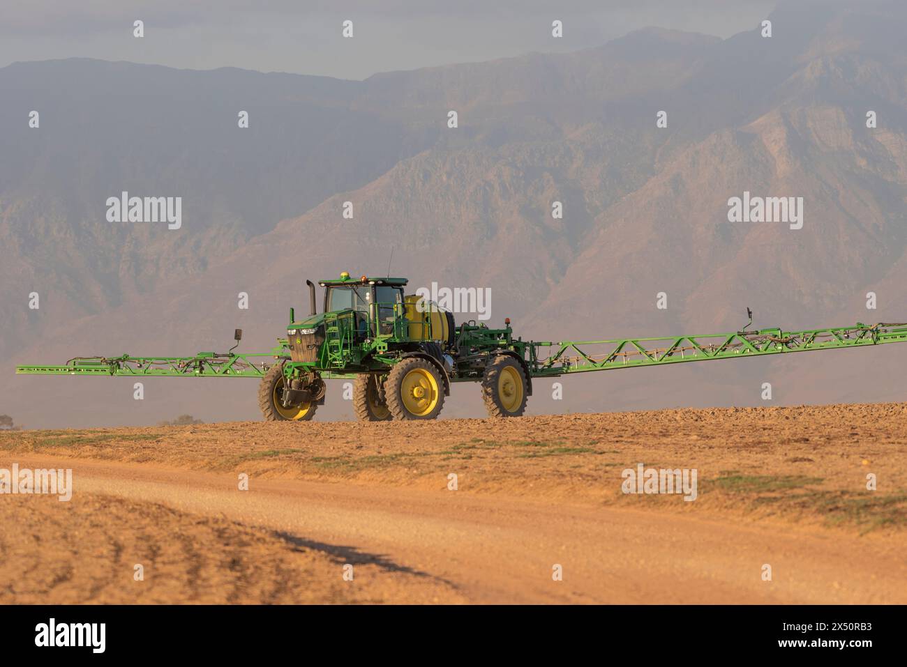 Western Cape, South Africa. 24 th April 2024. Tractor with spray boom ...