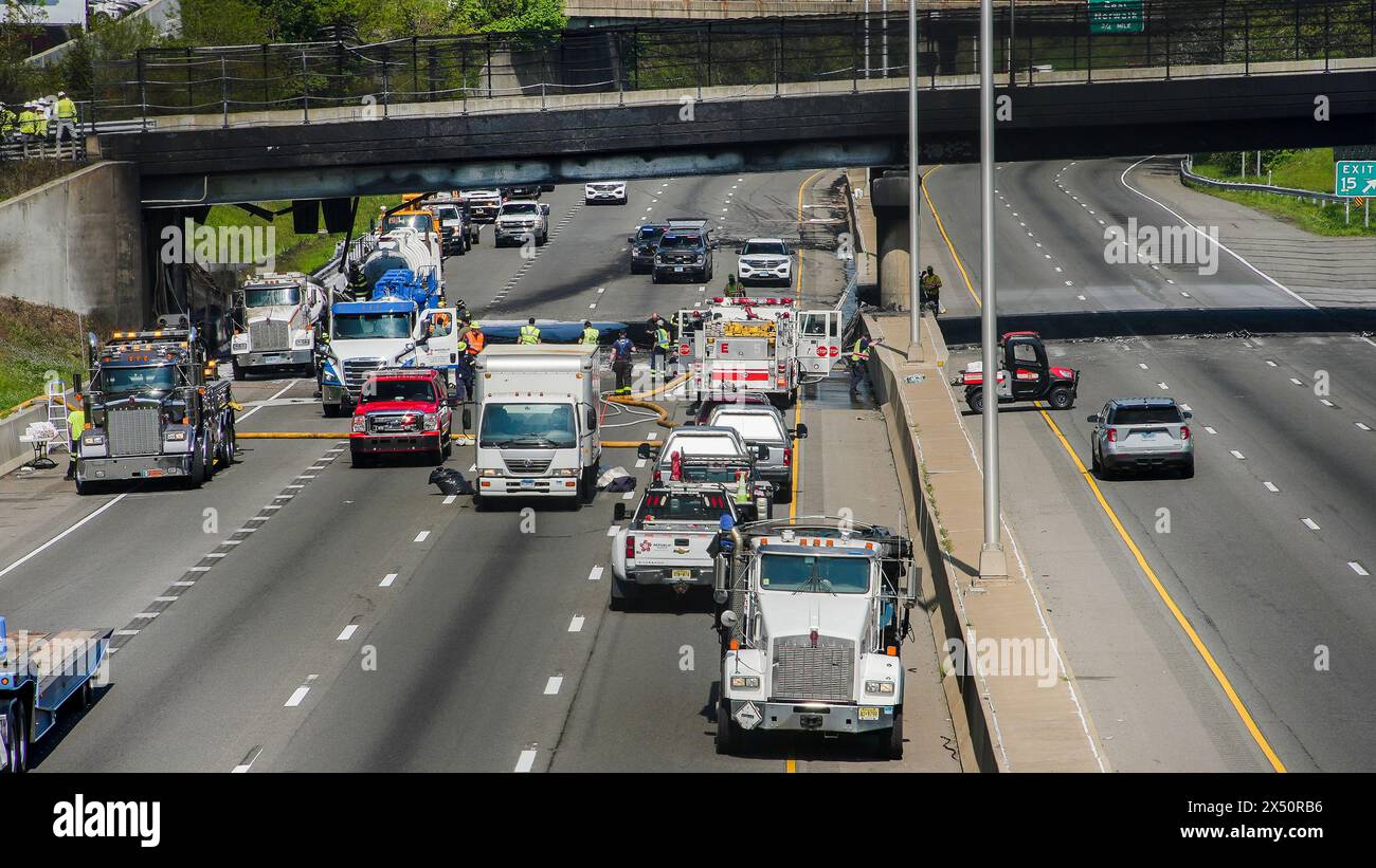 NORWALK, CT, USA- MAY 2, 2024: Cleaning I 95 after a tractor-trailer ...