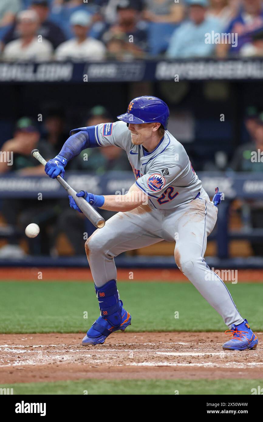 St. Petersburg, FL: New York Mets third base Brett Baty (22) bunts to ...