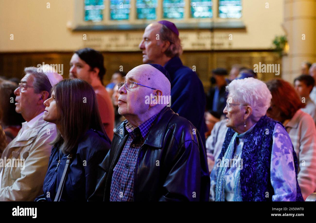 Guest listen to speakers during a ceremony observing the 60th Annual ...