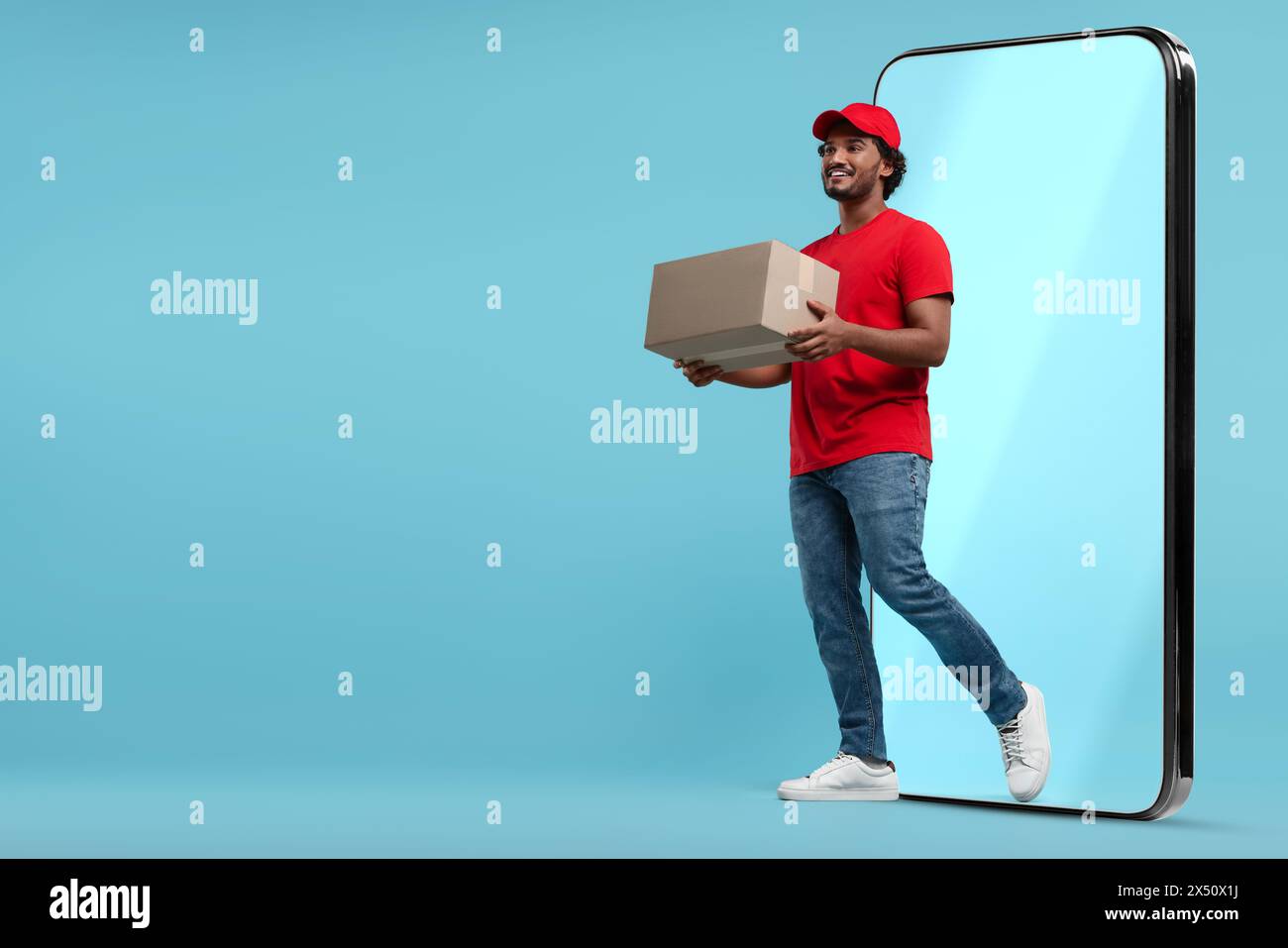 Courier with parcel walking out from huge smartphone on light blue ...