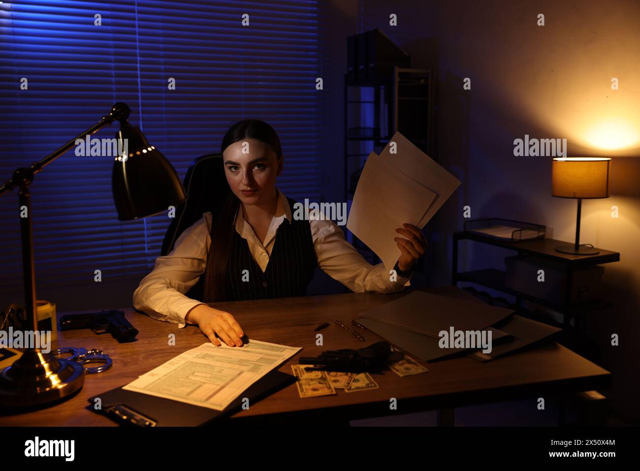 Professional detective working documents hi-res stock photography and ...