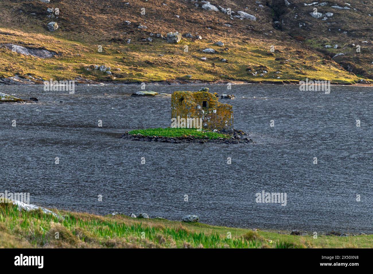 Macleod's Tower in Loch Tangasdale, Ilse of Barra, Scotland Stock Photo ...