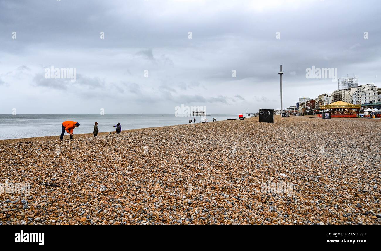 Brighton UK 6th May 2024 - Only a few visitors brave the weather on ...